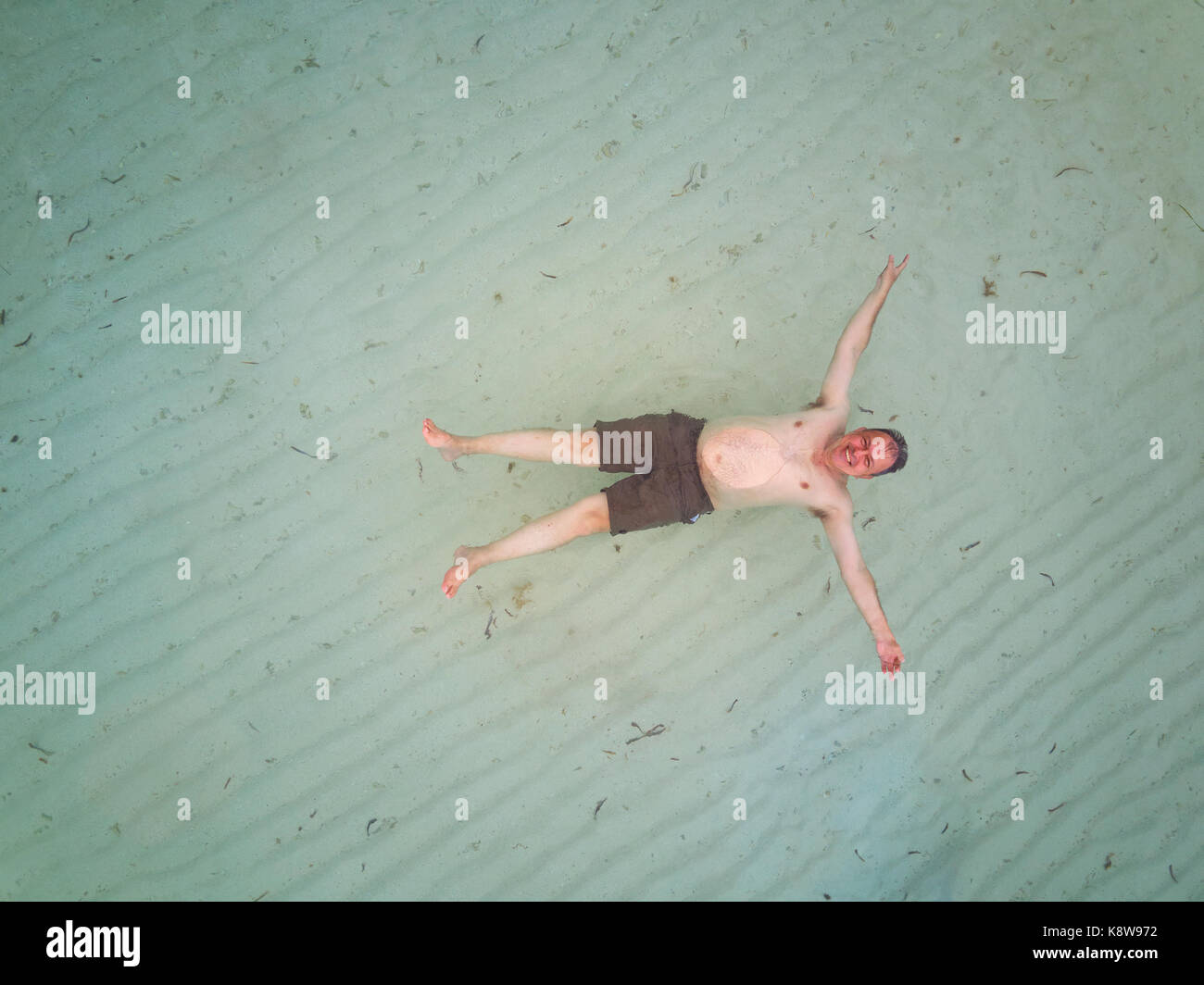 Woman float sea hi-res stock photography and images - Alamy