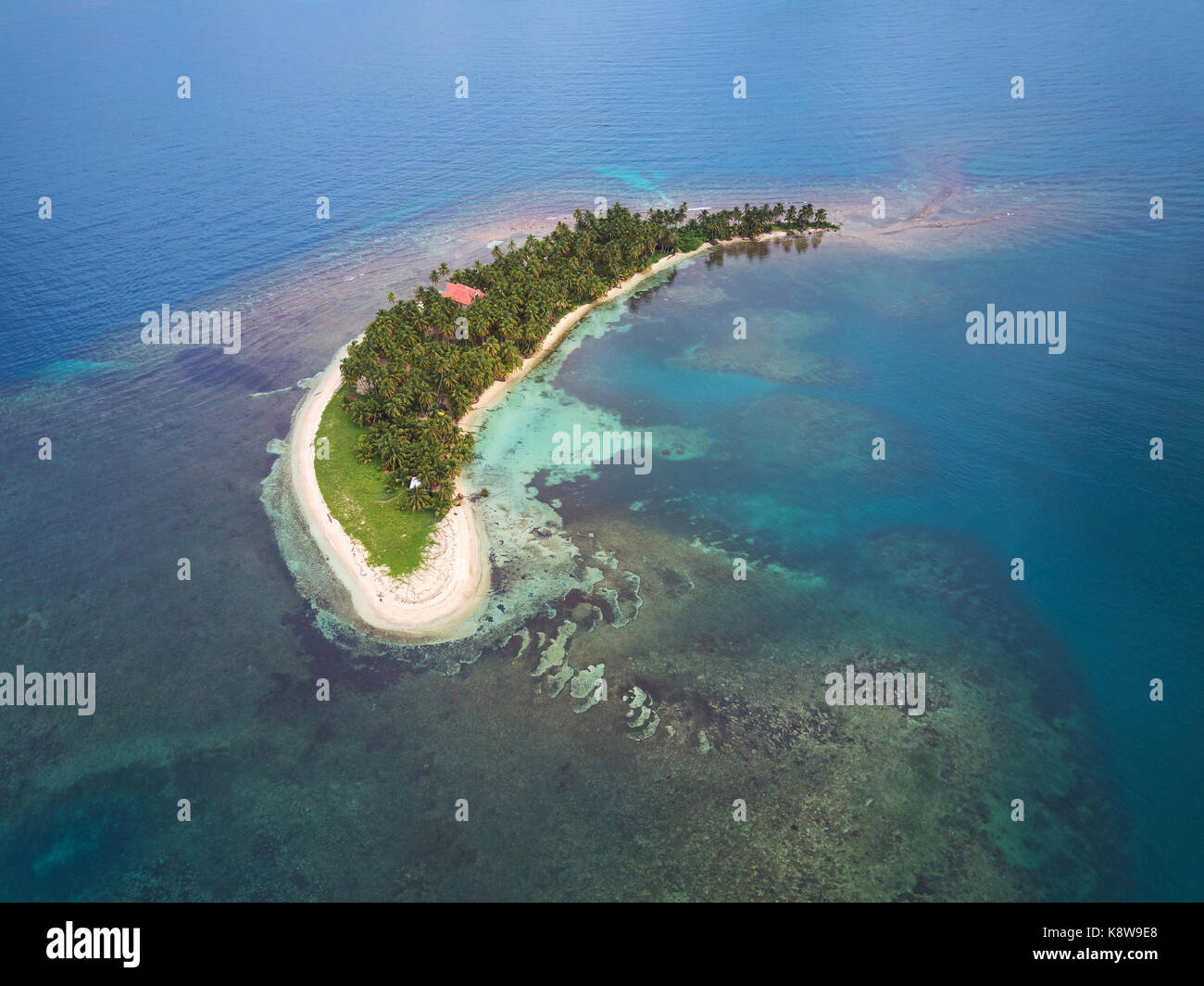 One small island in blue sea water aerial drone view Stock Photo - Alamy