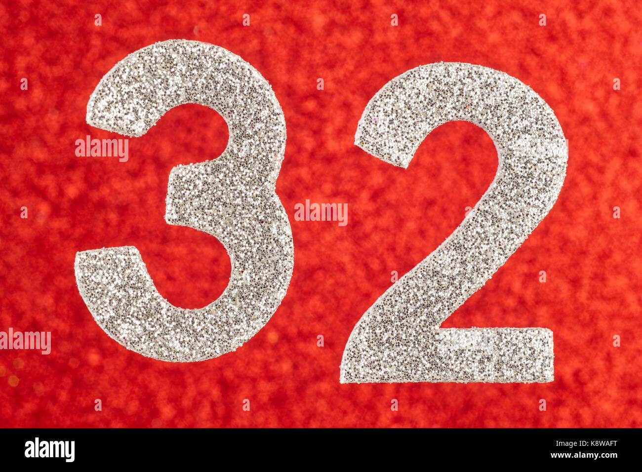 Number thirty-two silver color over a red background. Anniversary ...