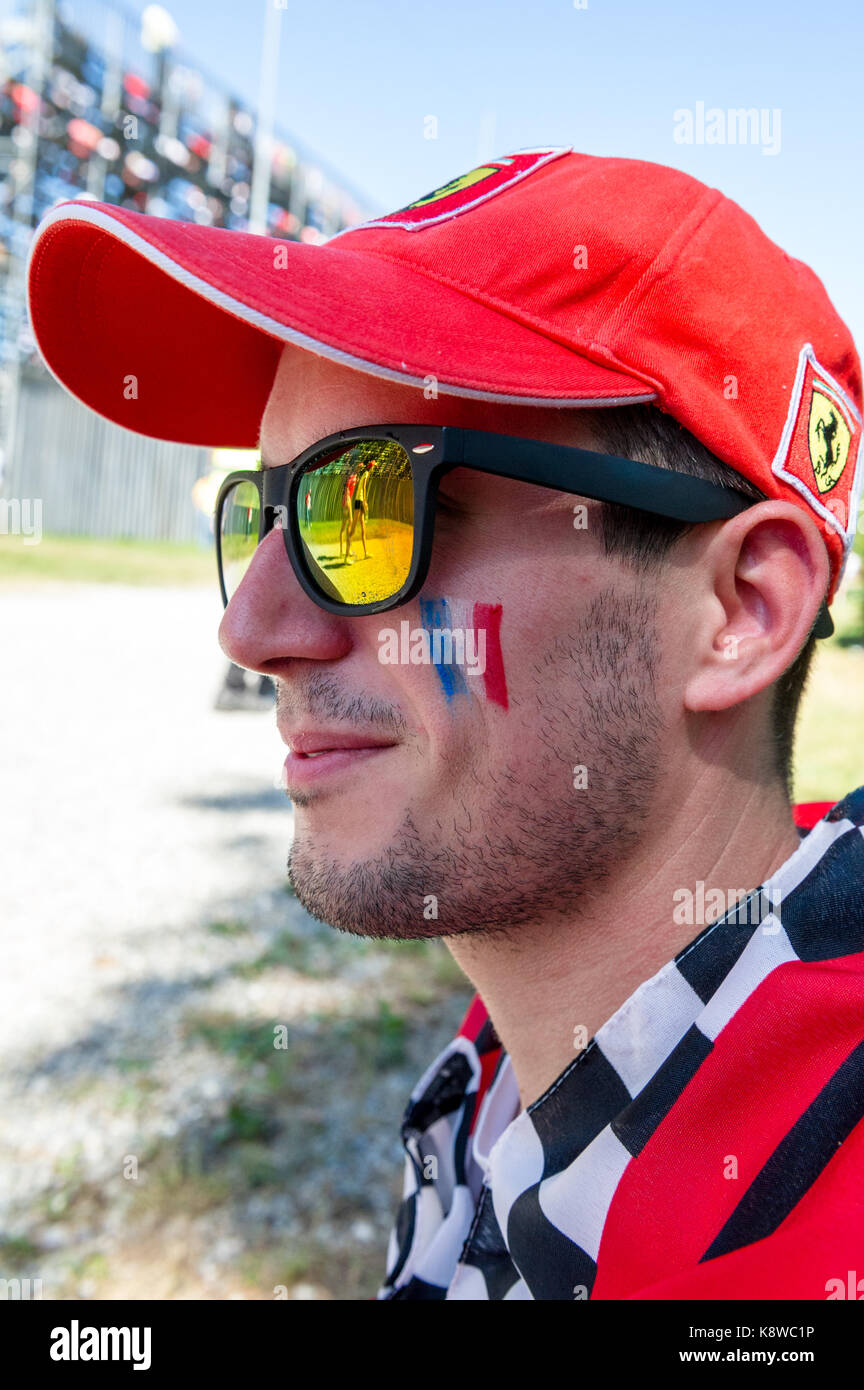 Male Ferrari formula fan with French flag face painting Stock Photo - Alamy
