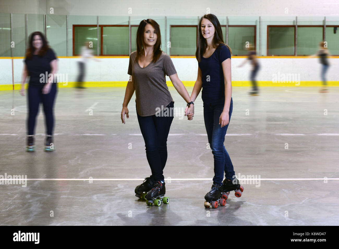 mother and daughter at roller skating rink focus on mom Stock Photo - Alamy