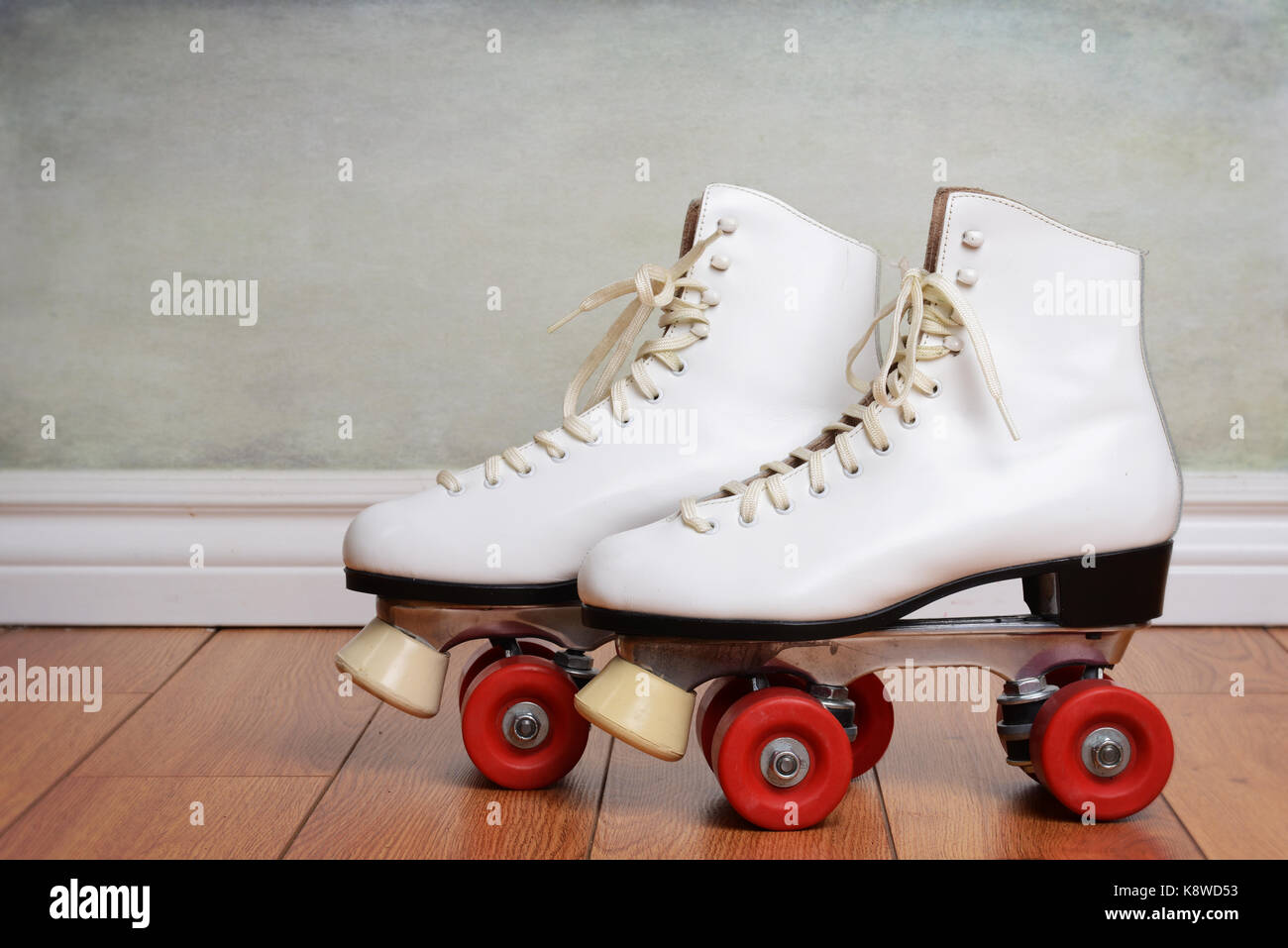 pair women white quad roller skates Stock Photo - Alamy