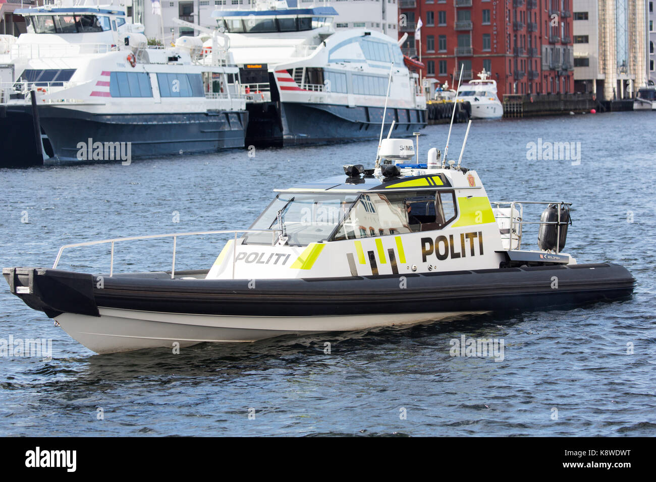 A Norwegian Police Fast Patrol Boat cruising around Bergen Harbour ...