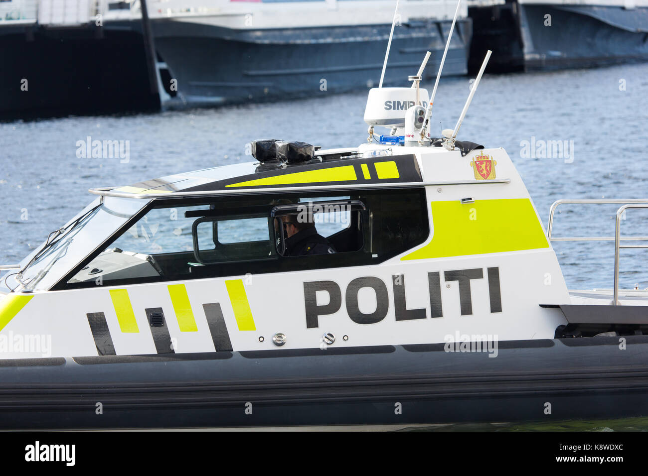 A Norwegian Police Fast Patrol Boat cruising around Bergen Harbour ...
