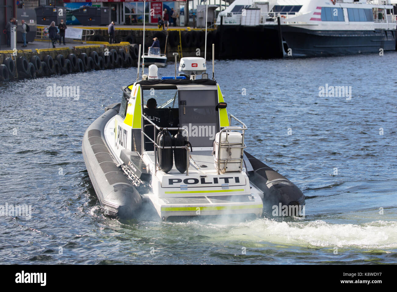 A Norwegian Police Fast Patrol Boat cruising around Bergen Harbour ...