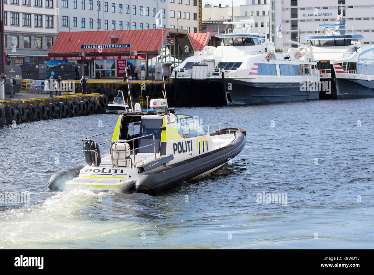 A Norwegian Police Fast Patrol Boat cruising around Bergen Harbour ...