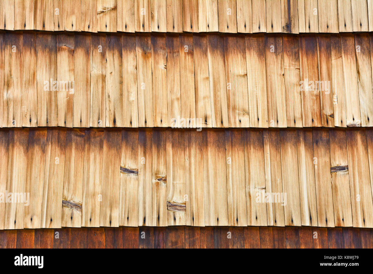 Wall of the building shingle with boards. Wooden lining of a building ...