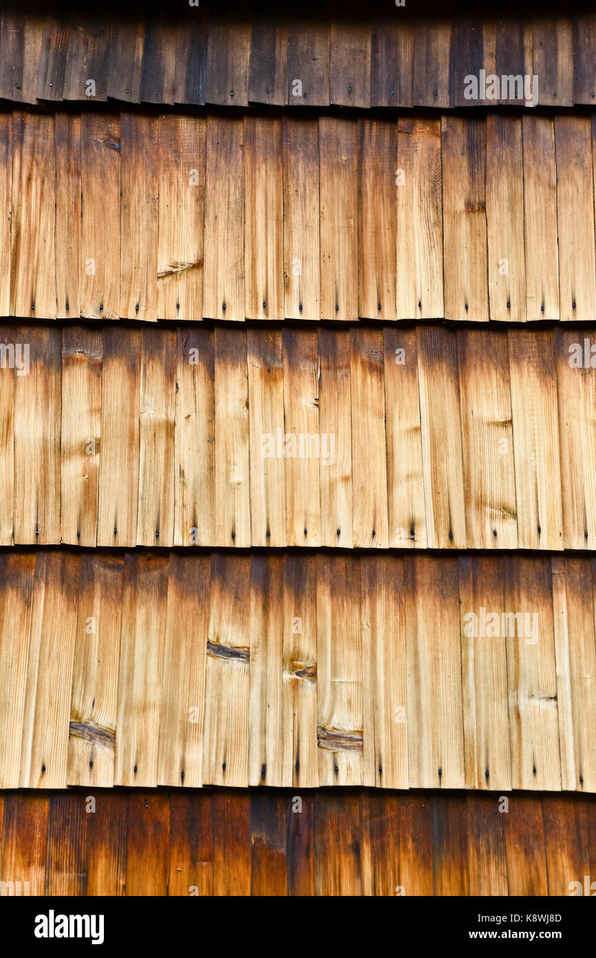 Wall of the building shingle with boards. Wooden lining of a building ...
