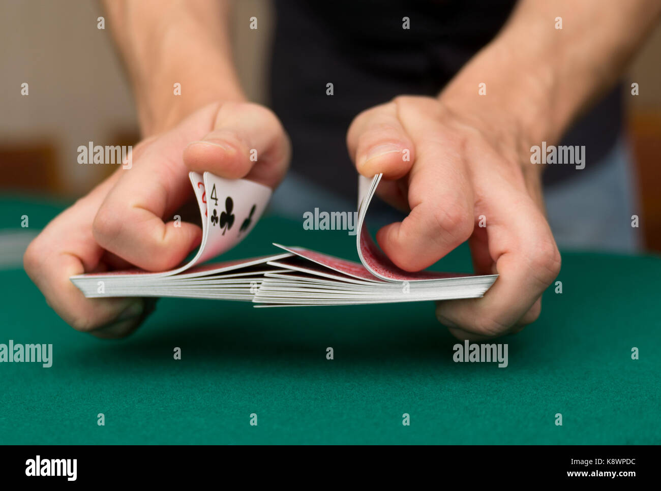 Poker player shuffling cards, close-up Stock Photo - Alamy