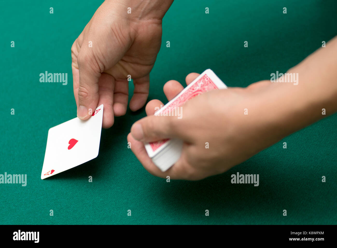 Poker player holding playing cards Stock Photo - Alamy
