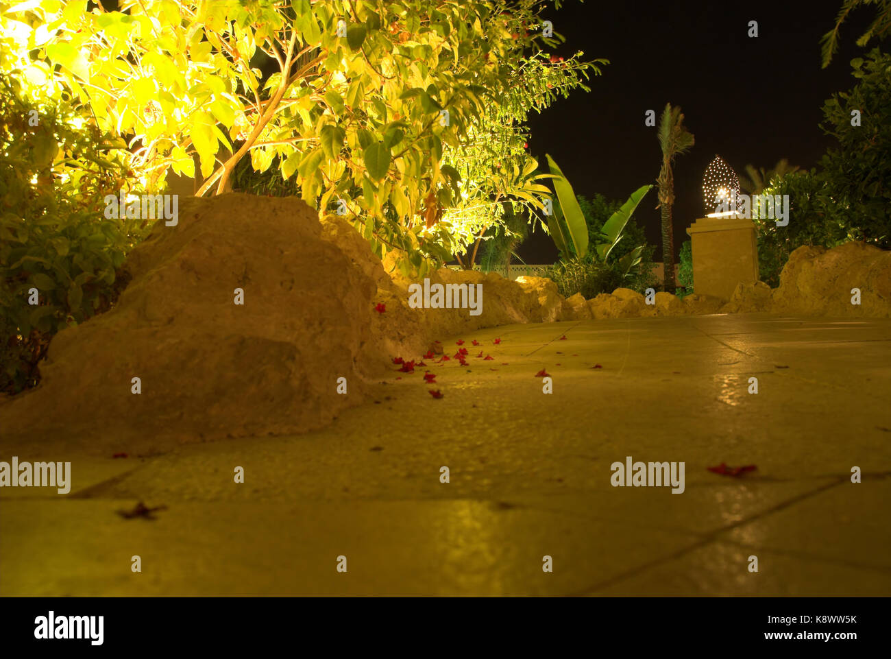 Walkway in hotel territory at night Stock Photo - Alamy