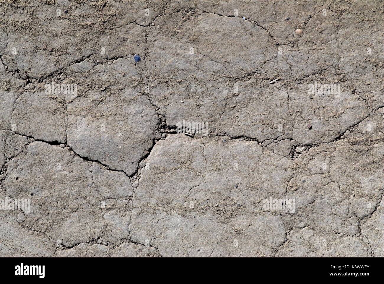 Texture of gray soil surface with clefts Stock Photo - Alamy
