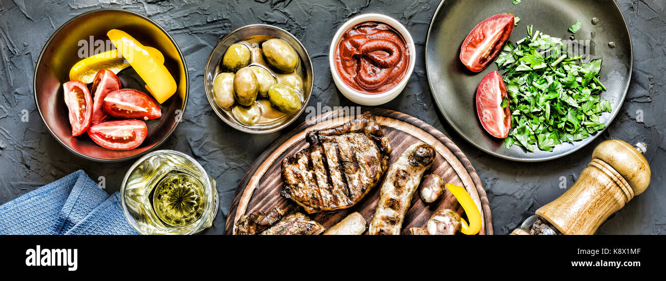 Man eats a juicy barbecue steak. movie effect Stock Photo - Alamy