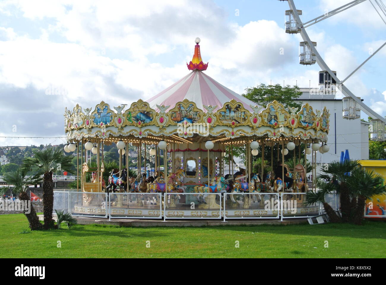 Merry-go-round next to the 'English Riviera Wheel' Torquay Promenade ...