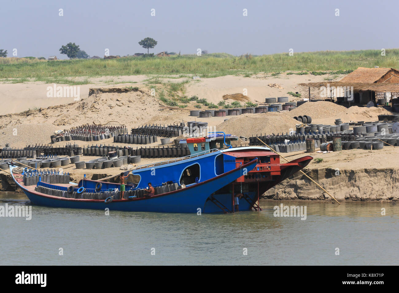 Concrete precast industry on the sandy banks of the Irrawaddy River in ...