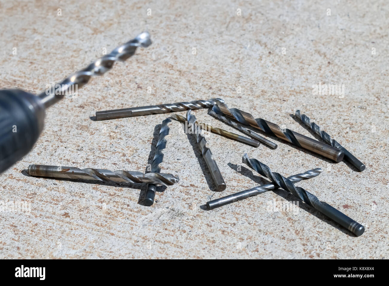 The Isolated Drill Bits with the Gray Ground Background Stock Photo - Alamy