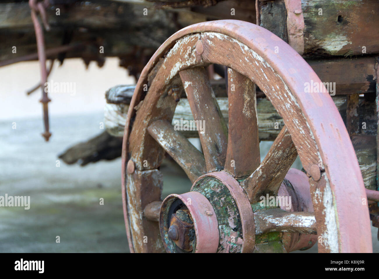 Close up of old wooden carriage wheel Stock Photo - Alamy