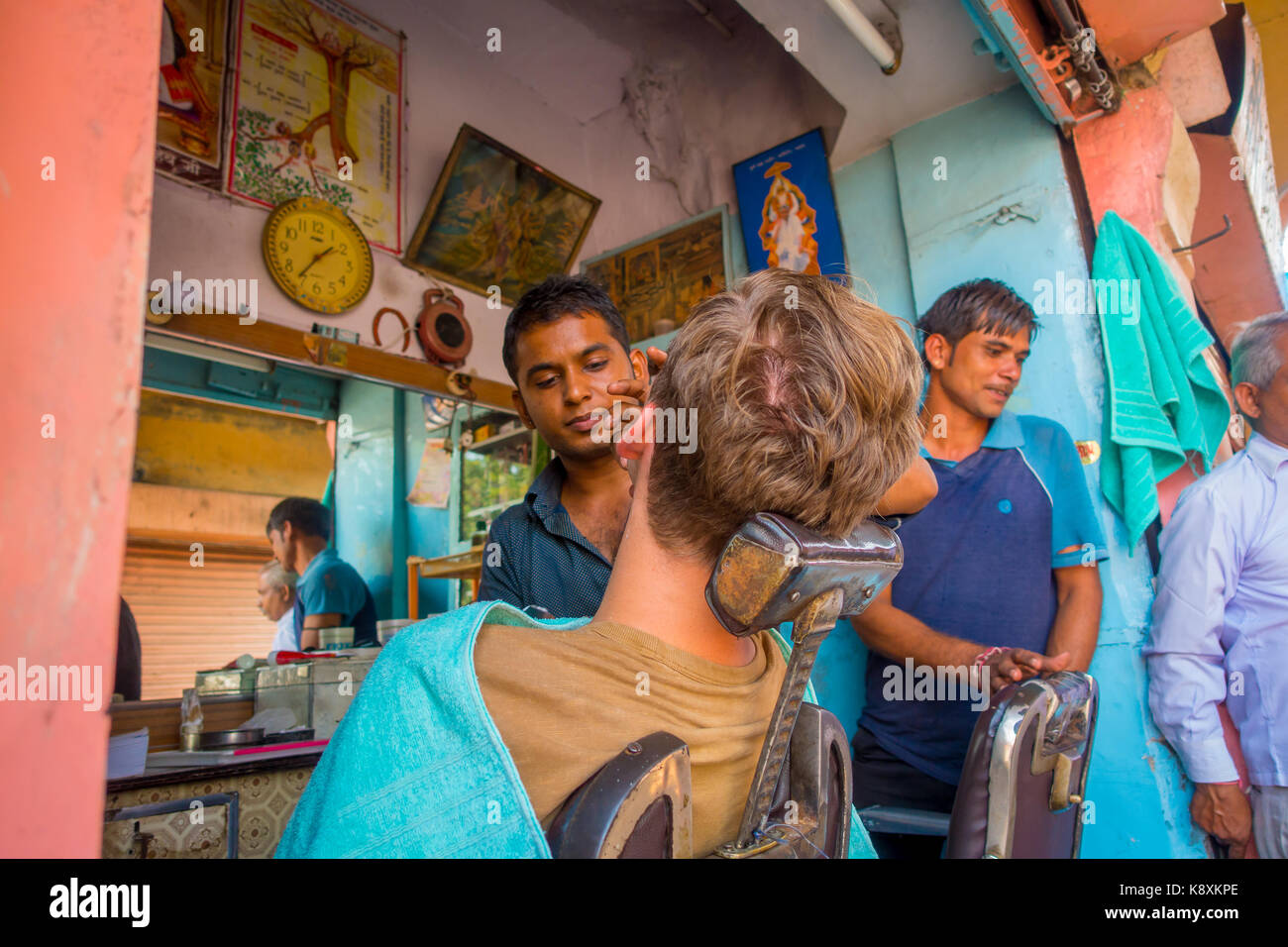Jaipur, India - September 20, 2017: Barber shaving a man using an open ...