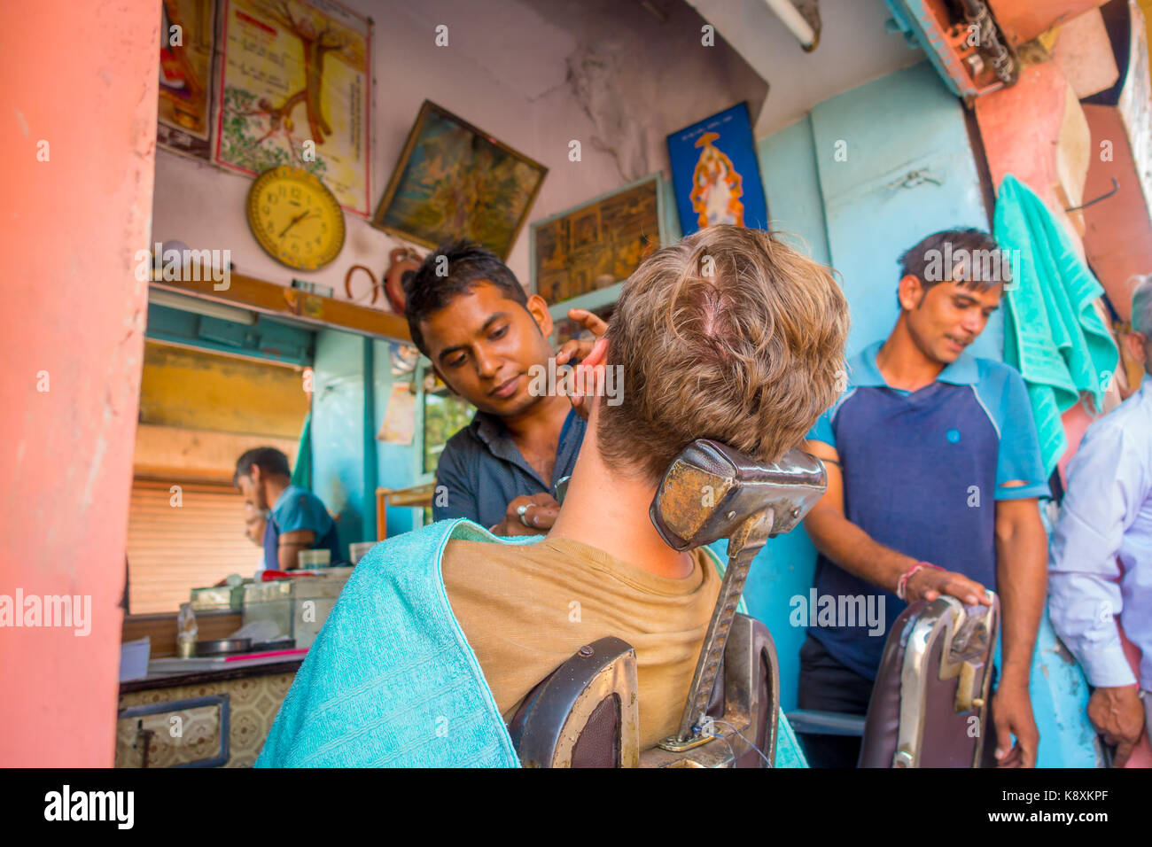 Jaipur, India - September 20, 2017: Barber shaving a man using an open ...