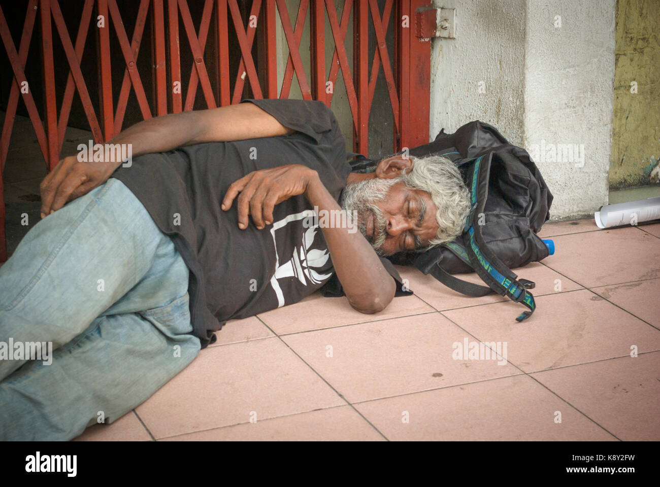 Homeless man sleeping on the street in Bangkok, Thailand Stock Photo ...