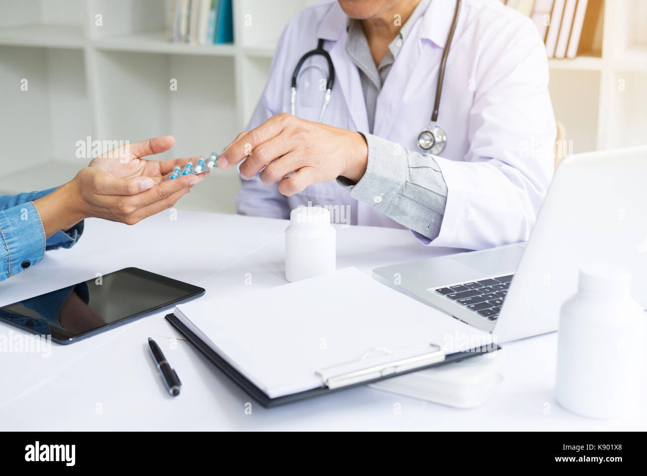 Female doctor hand holding tablet to patient in hospital room Stock ...