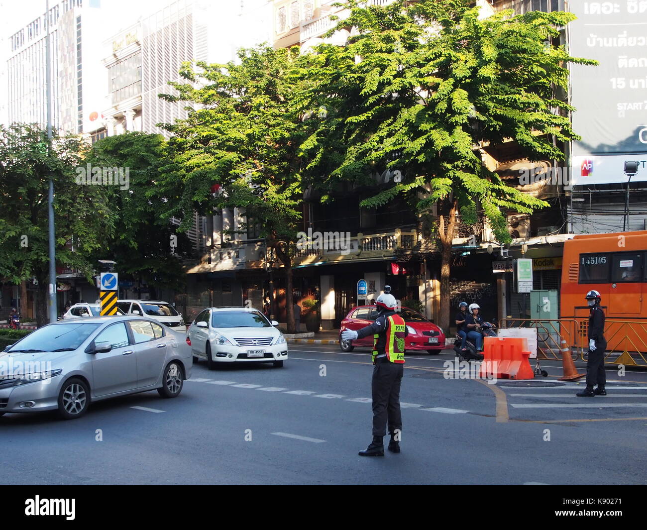 a Thai Police manage and control the traffic in the morning.. 21th ...