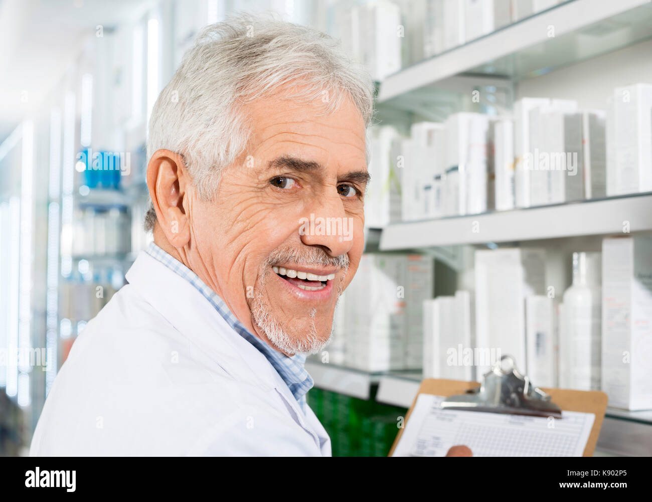 Confident Senior Pharmacist Counting Stock In Drugstore Stock Photo - Alamy