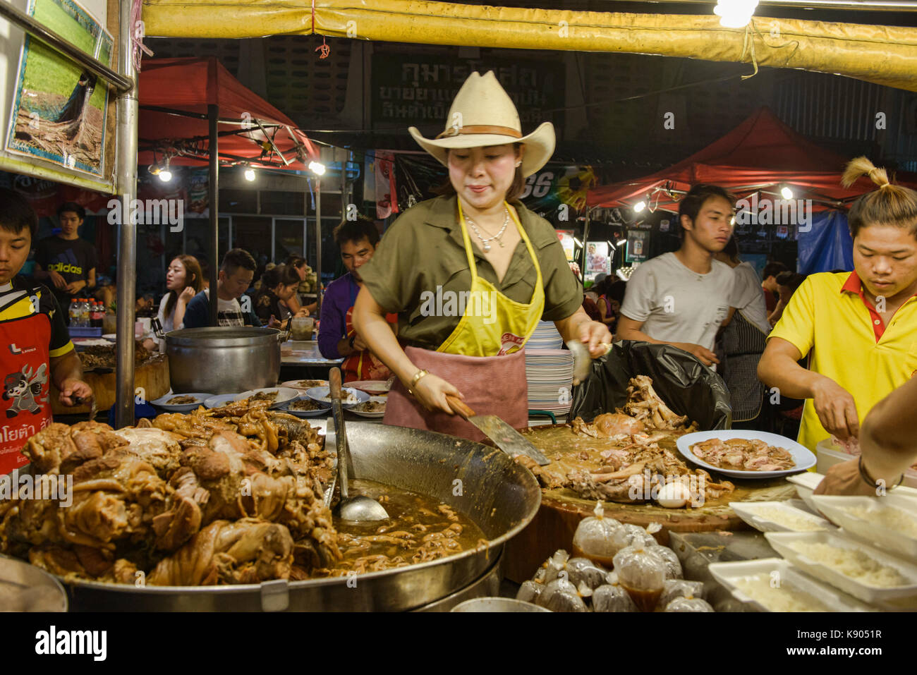 The famous Khao Ka Moo Cowboy pork knuckle cook in Chiang Mai, Thailand ...