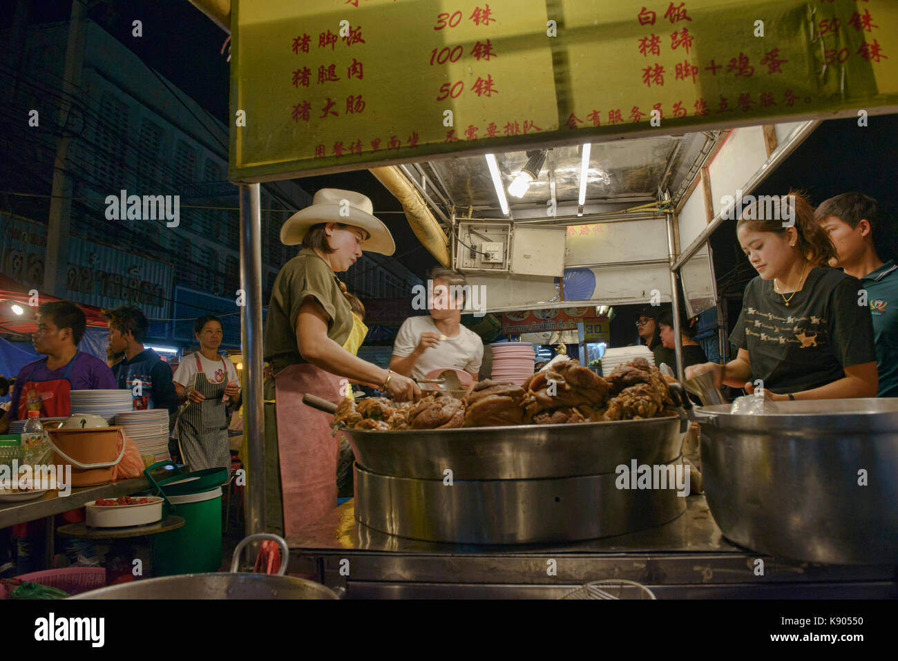 The famous Khao Ka Moo Cowboy pork knuckle cook in Chiang Mai, Thailand ...