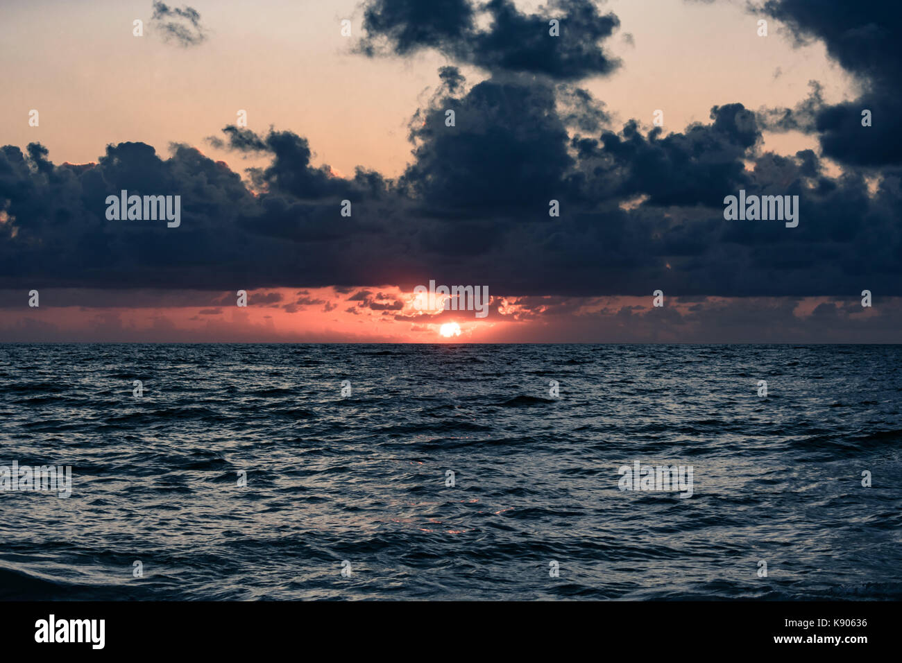 summer sun rising over the ocean Stock Photo - Alamy