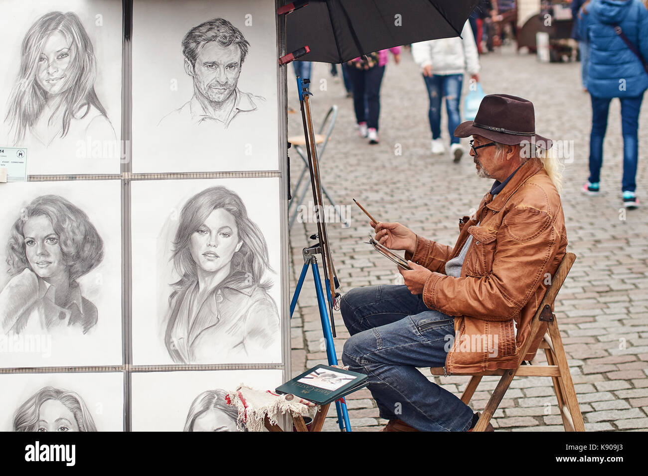 Prague, Czech Republic - September 27, 2014: Street portrait painter ...