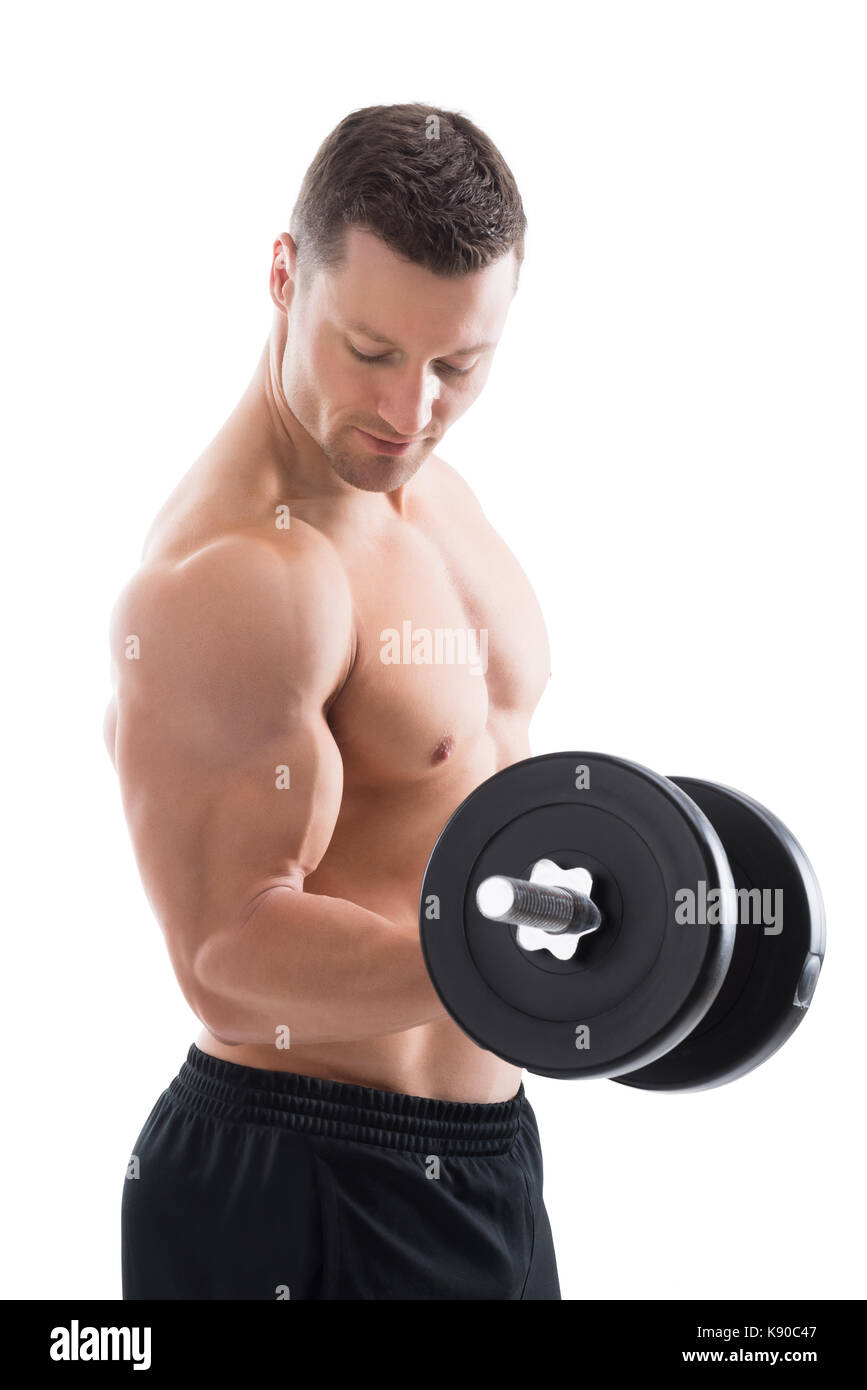 Side view portrait of happy muscular man lifting dumbbell against white ...