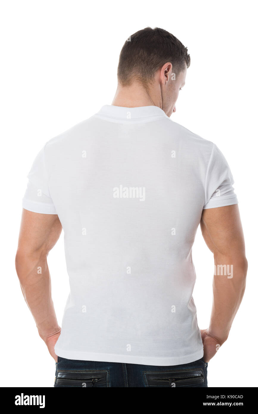 Rear view of man in casuals standing against white background Stock ...