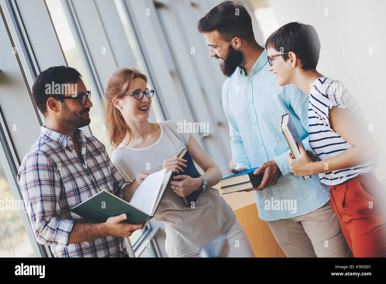 Group of students talking in classroom hi-res stock photography and ...