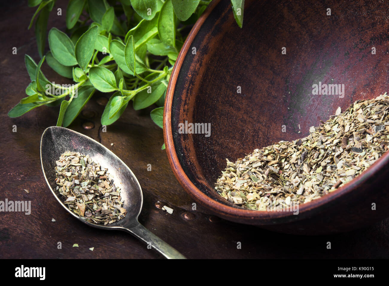 dried and fresh oregano herb on retro background Stock Photo - Alamy