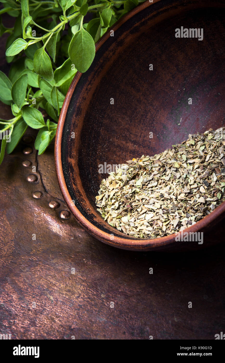 dried and fresh oregano herb on retro background Stock Photo - Alamy