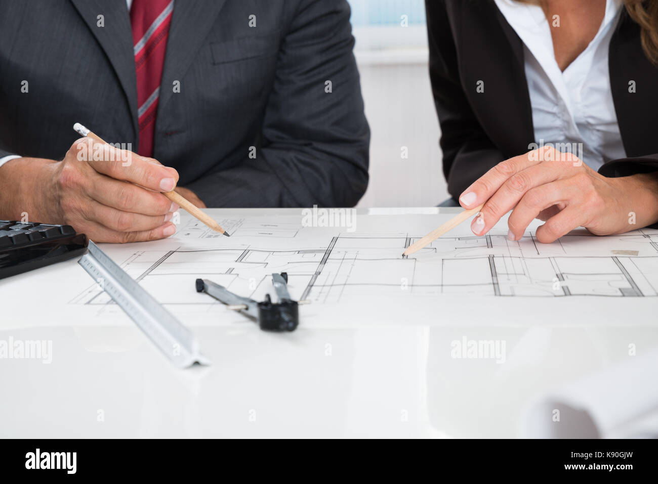 Close-up Of Two Architects Hands Working On Blueprint Stock Photo - Alamy
