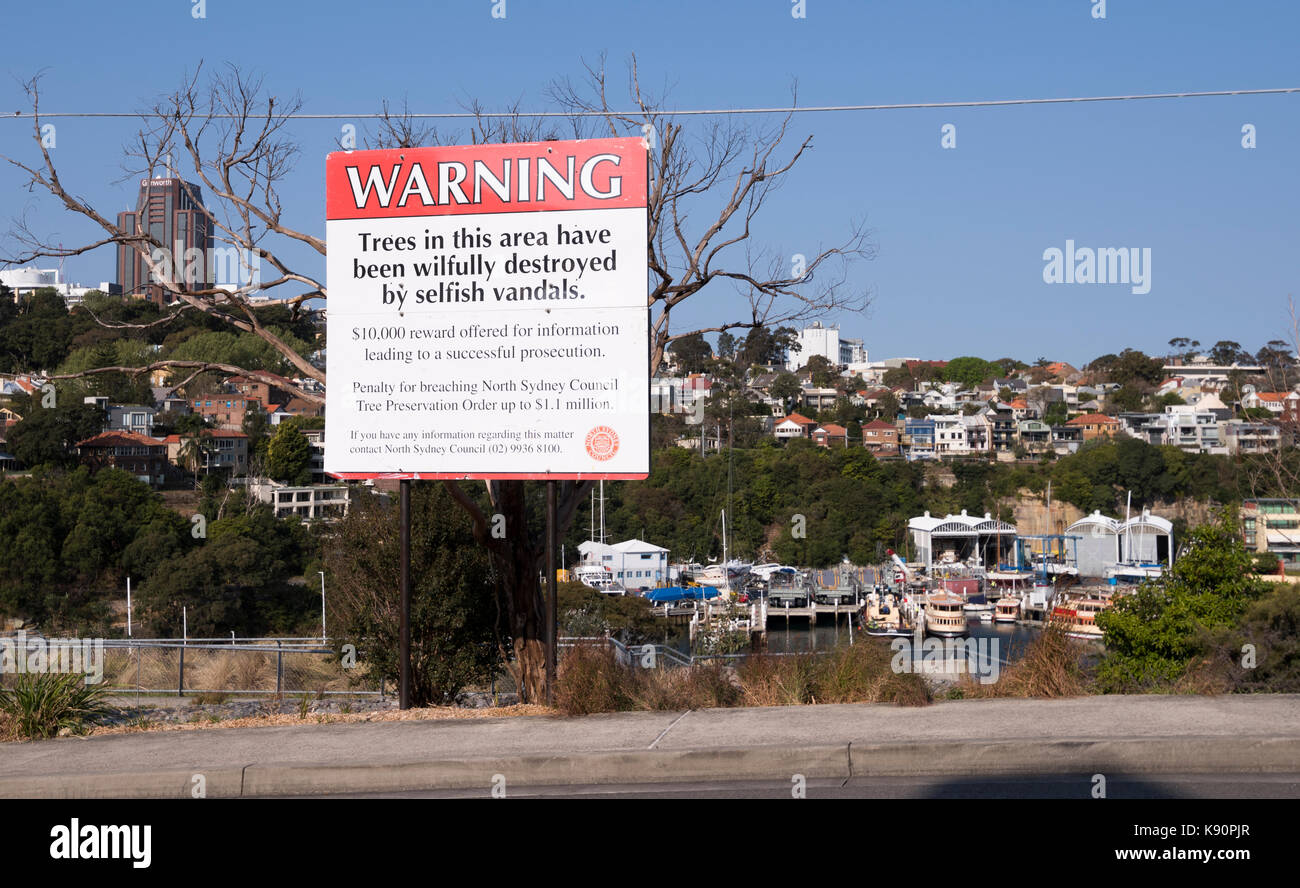Warning sign about illegal damage to trees on Larkin Street, Waverton ...