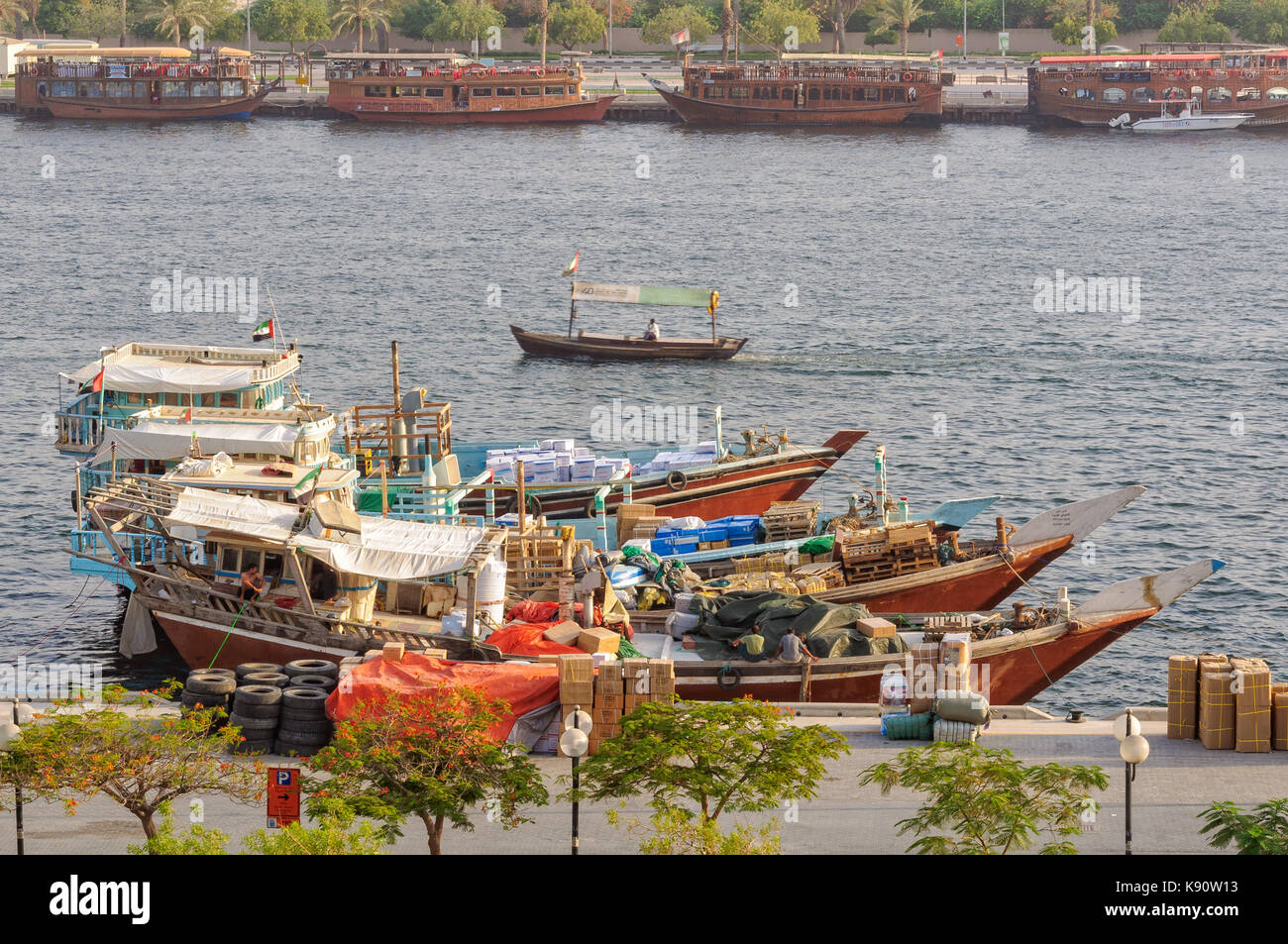 Traditional wooden boats, called dhow in Arabic, on anchor along the ...
