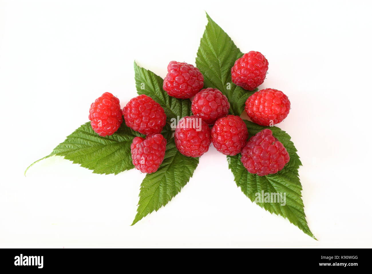 composition of fresh red raspberry fruits isolated on a white ...