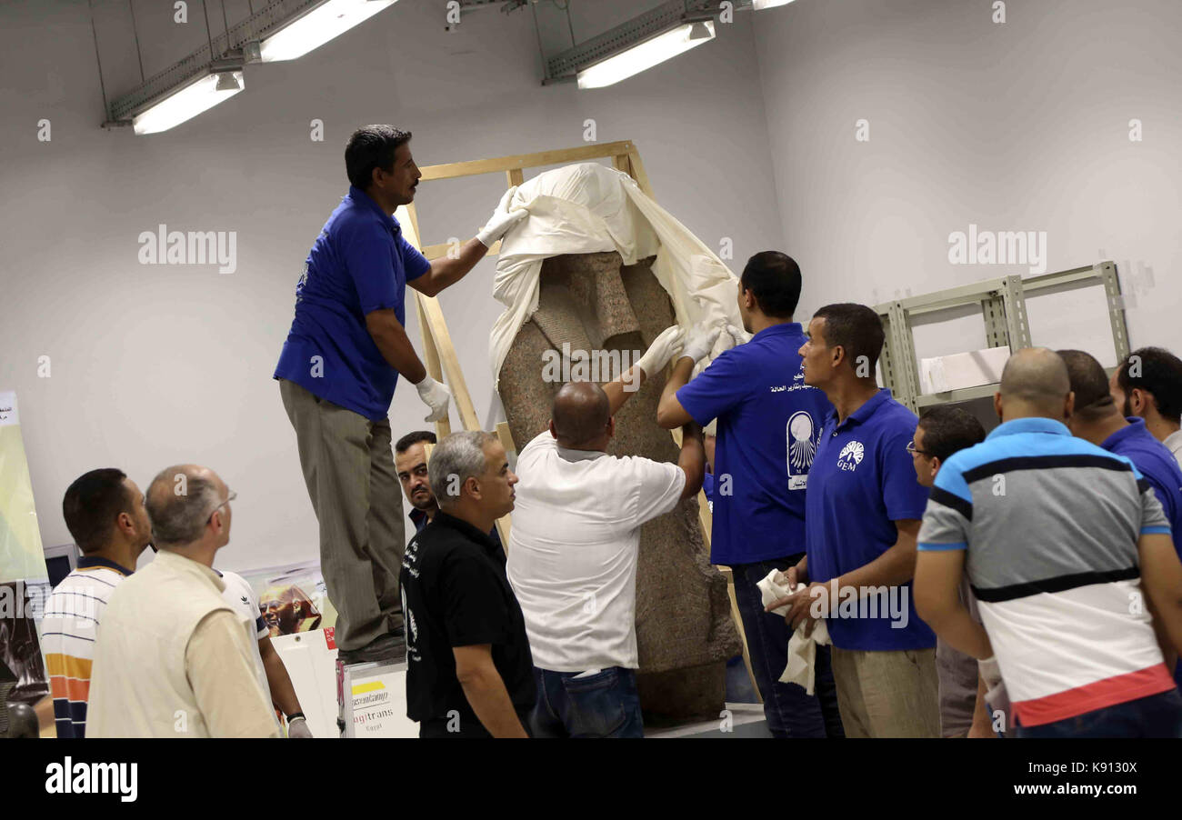 Cairo, Egypt. 20th Sep, 2017. Egyptian workers transport statues upon ...