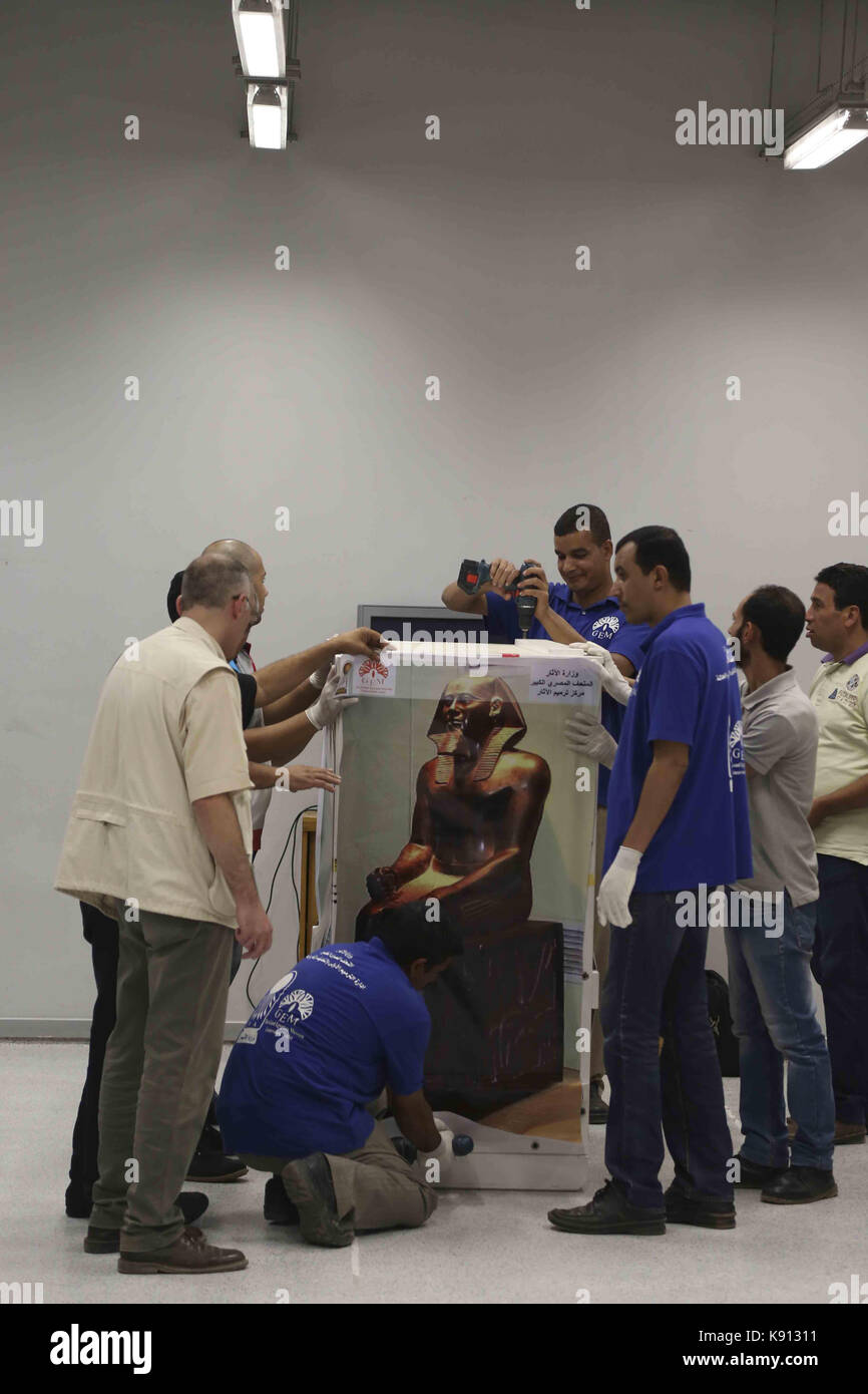 Cairo, Egypt. 20th Sep, 2017. Egyptian workers transport statues upon ...
