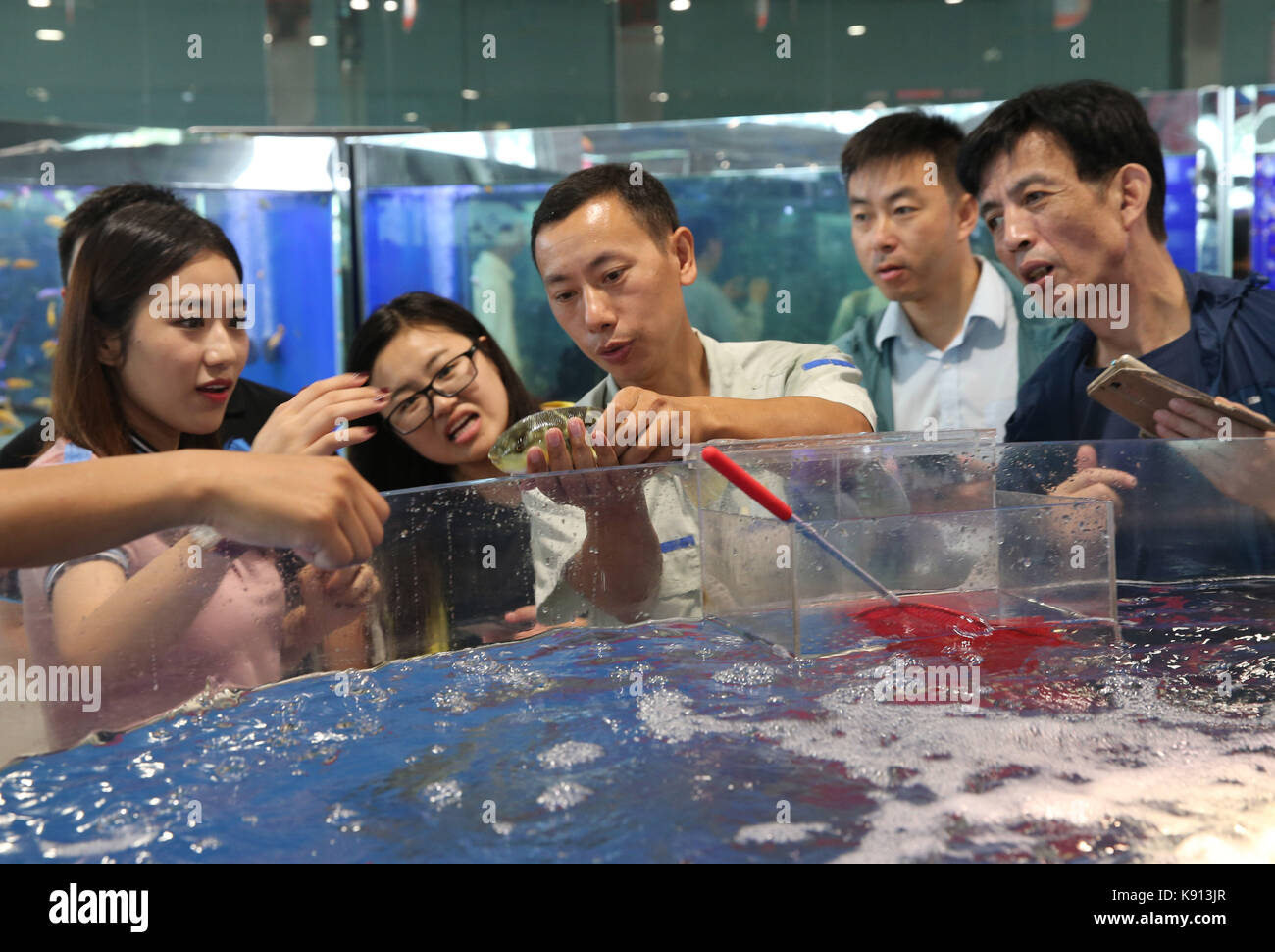 Nantong, China's Jiangsu Province. 20th Sep, 2017. Tourists try to ...
