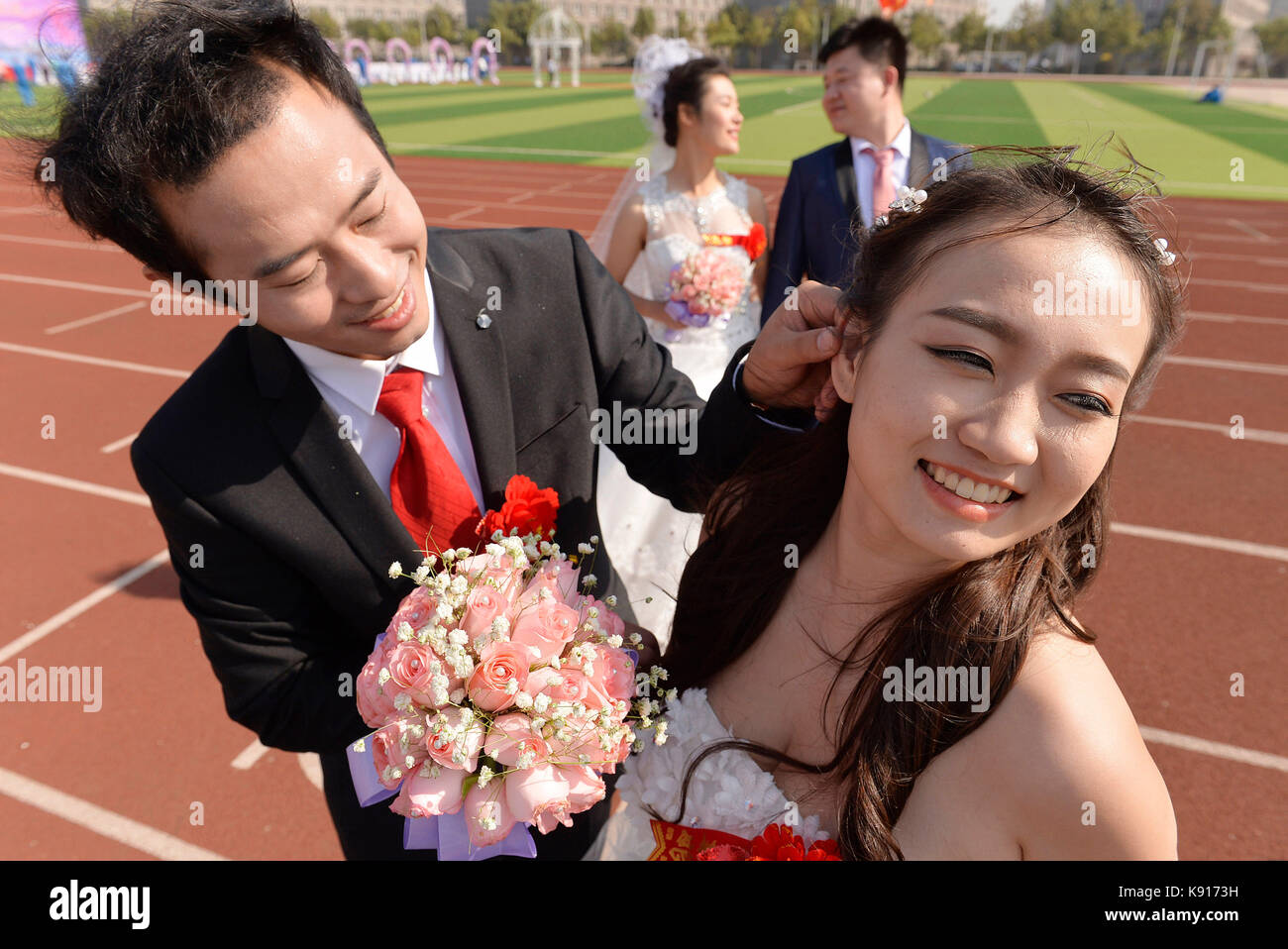 Tangshan, China's Hebei Province. 21st Sep, 2017. Couples attend a ...