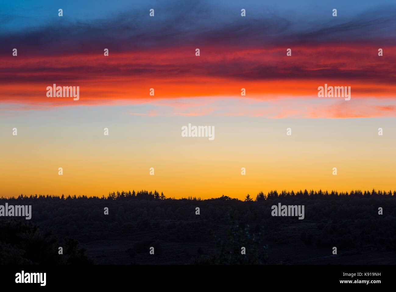 Red clouds in sunset sky over Hampshire landscape, UK Stock Photo - Alamy