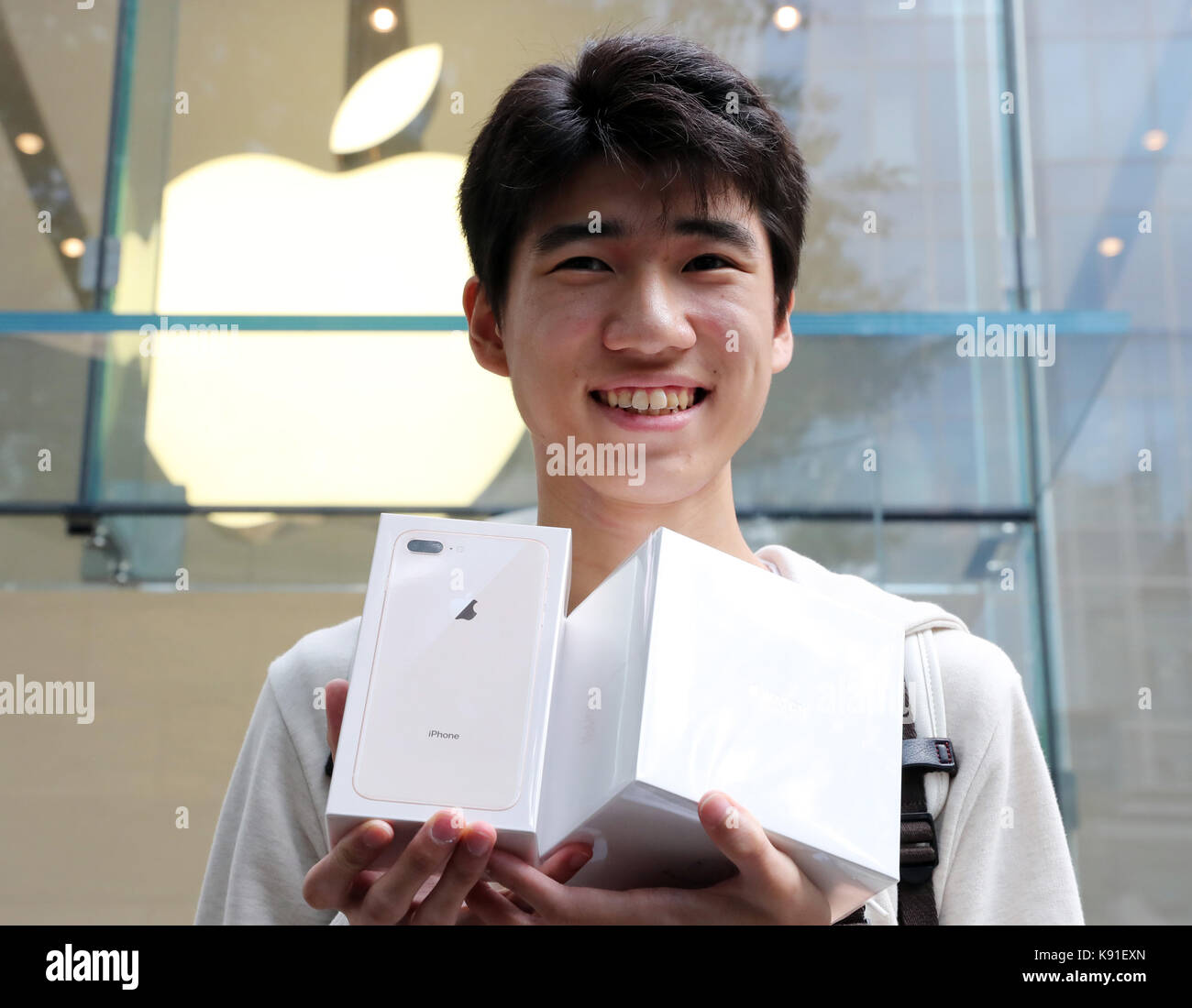 Tokyo, Japan. 22nd Sep, 2017. A customer smiles as he purchased Apple's ...