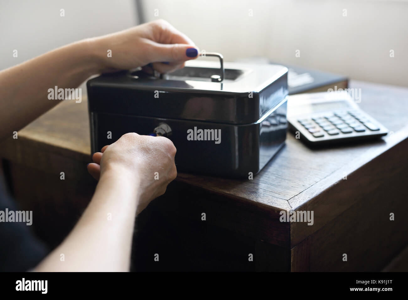 Money and savings kept in a locked box at home Stock Photo - Alamy