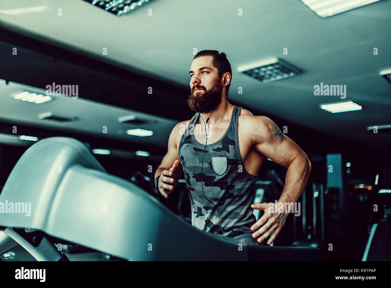 Muscle man running on treadmill Stock Photo - Alamy