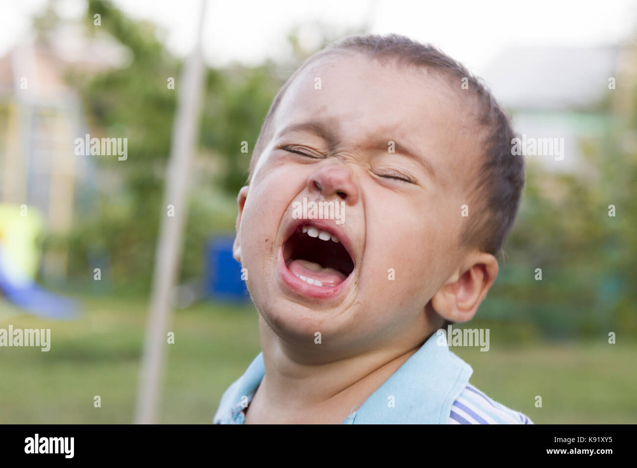 Angry, sad and unhappy baby child. shouting and crying. problem child ...