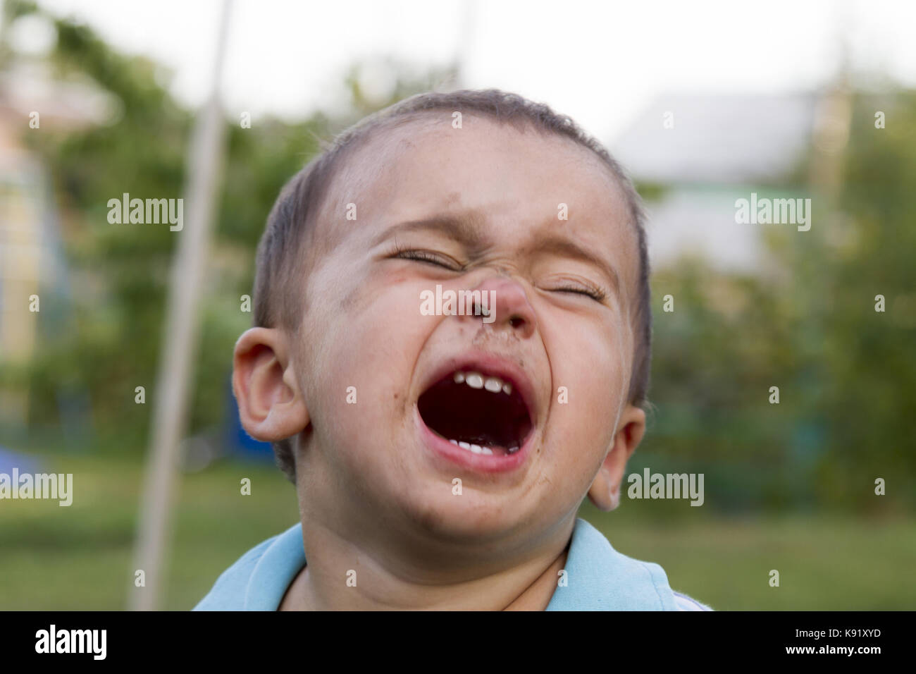 Crying baby boy. Outdoor Stock Photo - Alamy